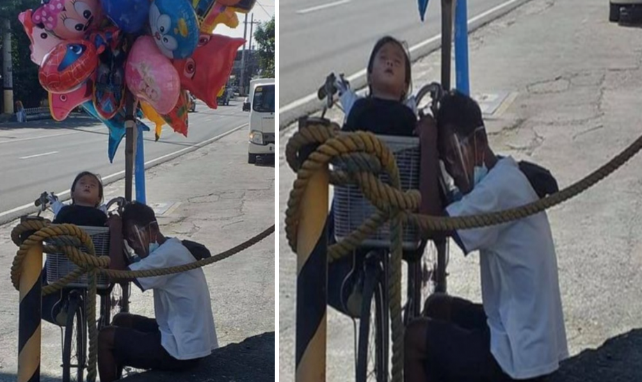 Isang masipag na ama, dala ang kaniyang musmos na anak habang naglalako ...